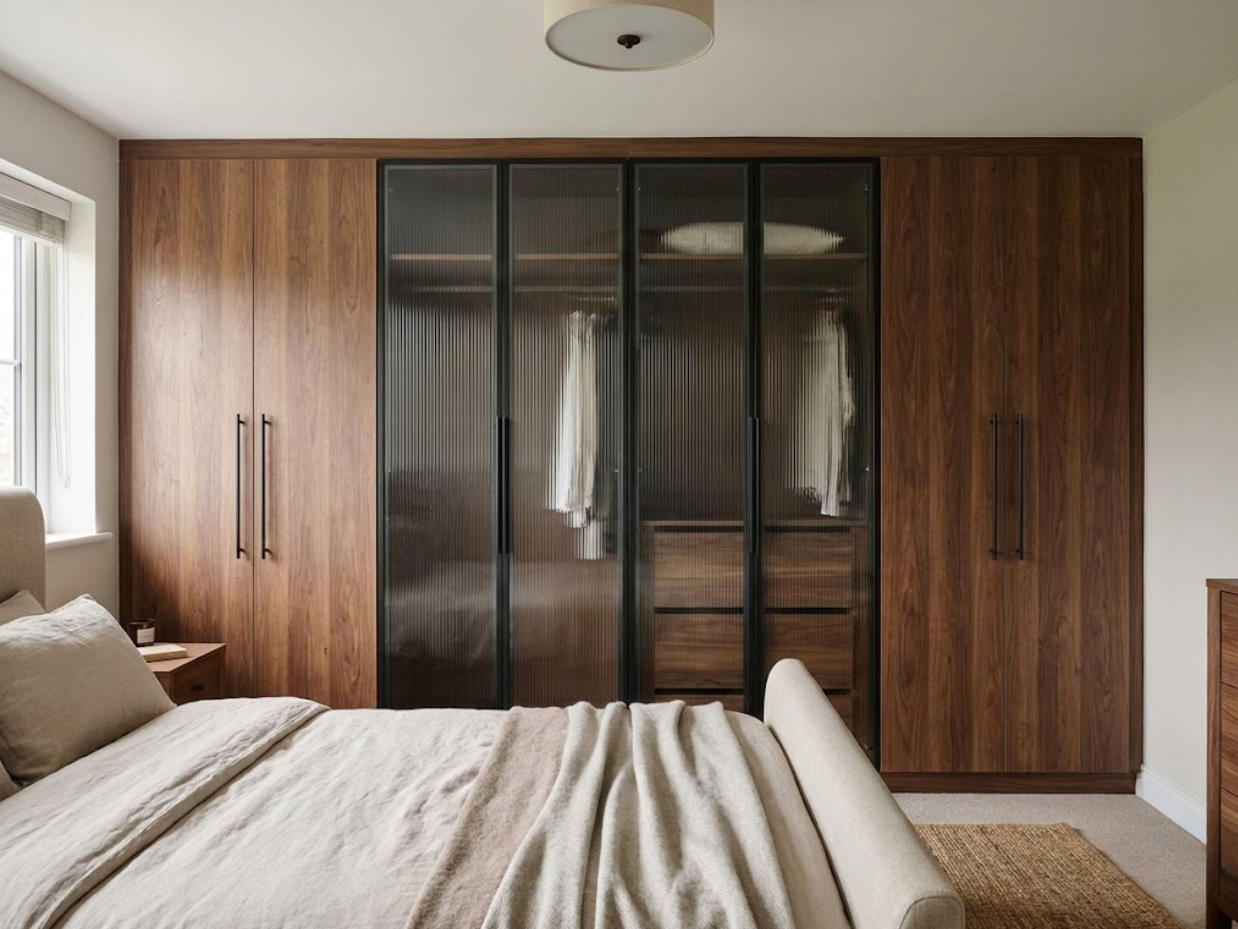 Hinged wardrobe with laminate and fluted glass shutters